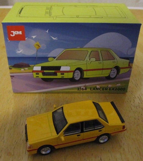 Mitsubishi Lancer 2000 EX Turbo Sedan 4 door Yellow 1983 JKM 1:64 | Tori